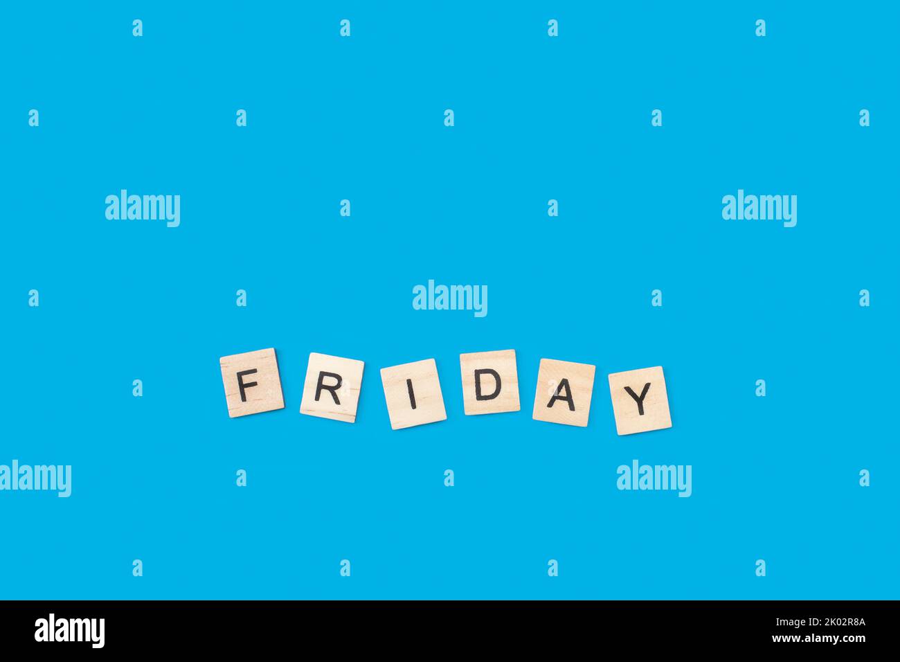 Friday write with wooden letter cubes on a blue background Stock Photo ...