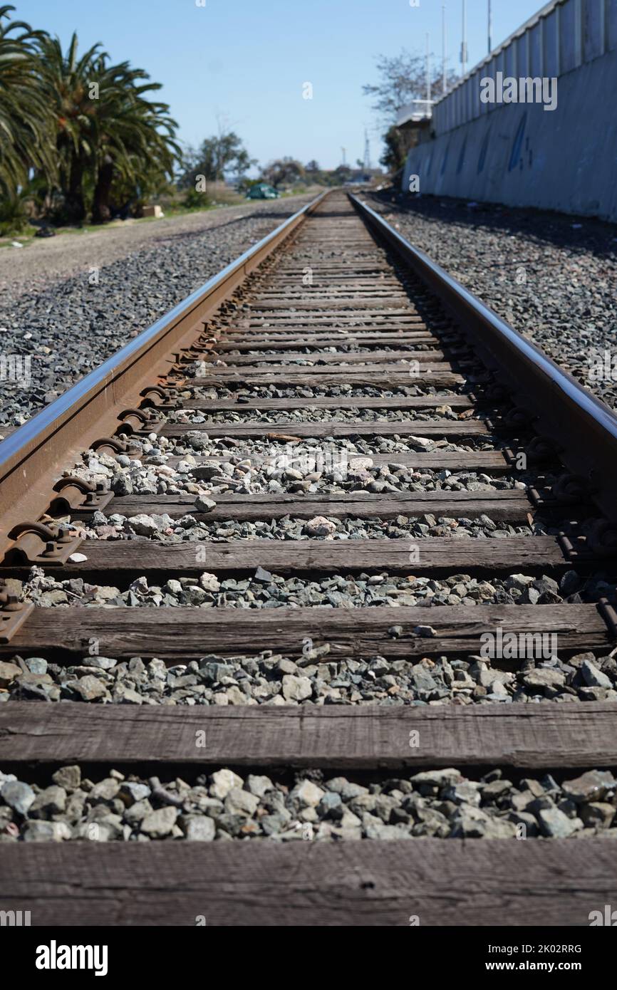 A vertical top view of brown and black train tracks Stock Photo - Alamy