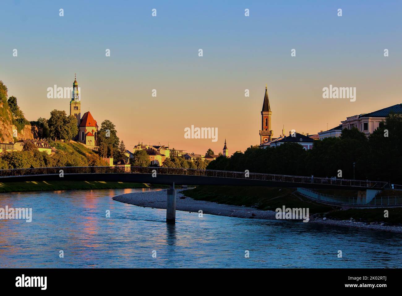 Shot looking at Marko-Feingold-Steg Bridge with Salzburg Evangelical ...