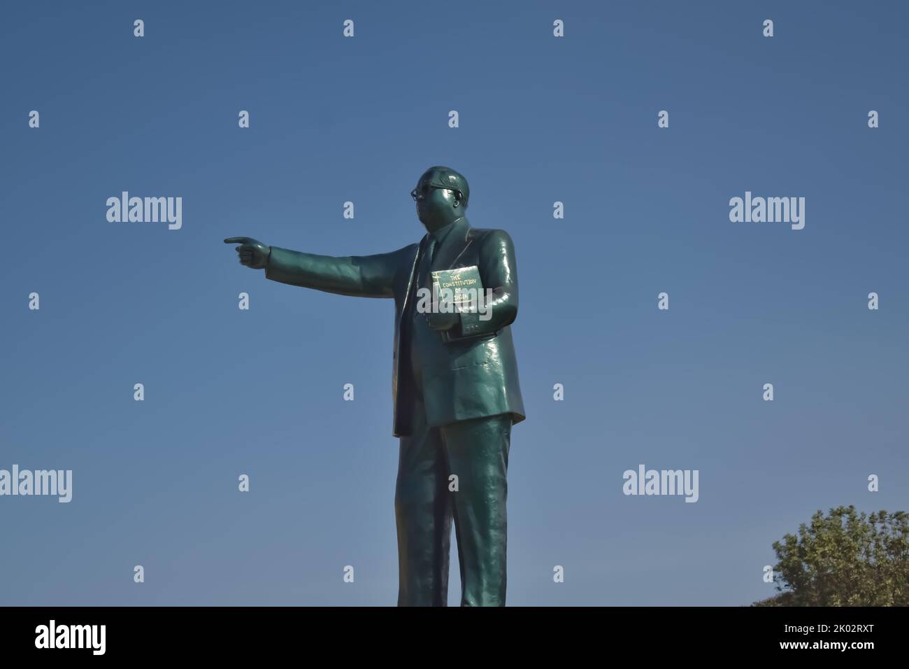 A closeup picture of Dr. B.R. Ambedkar statue or bust against a blue ...