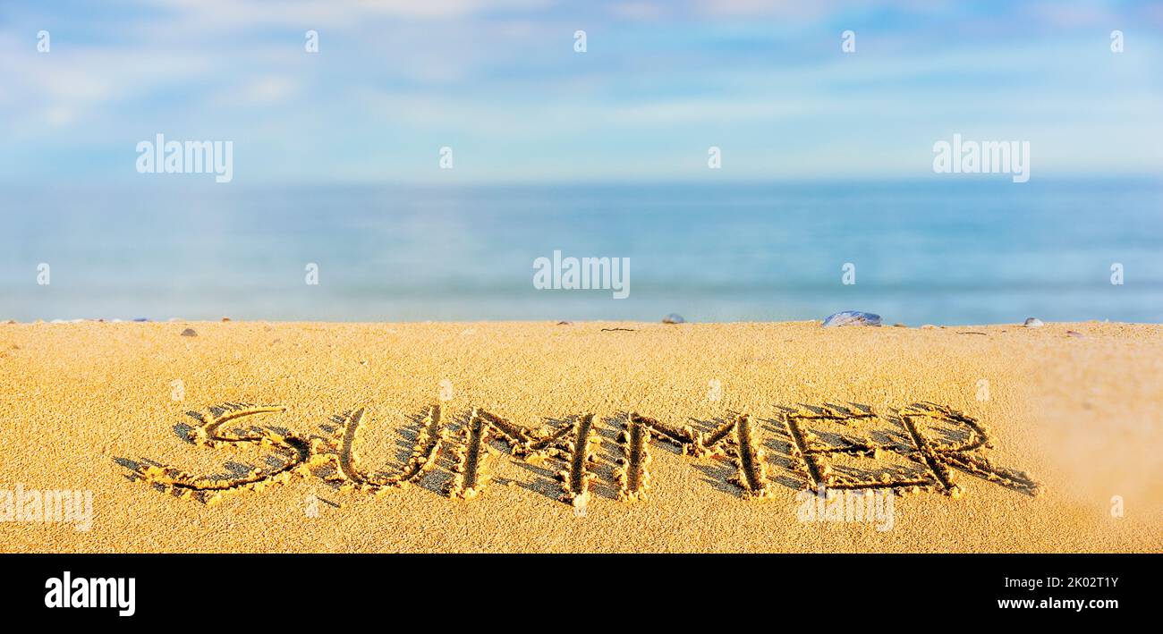 Summer written in the sand hi-res stock photography and images - Alamy