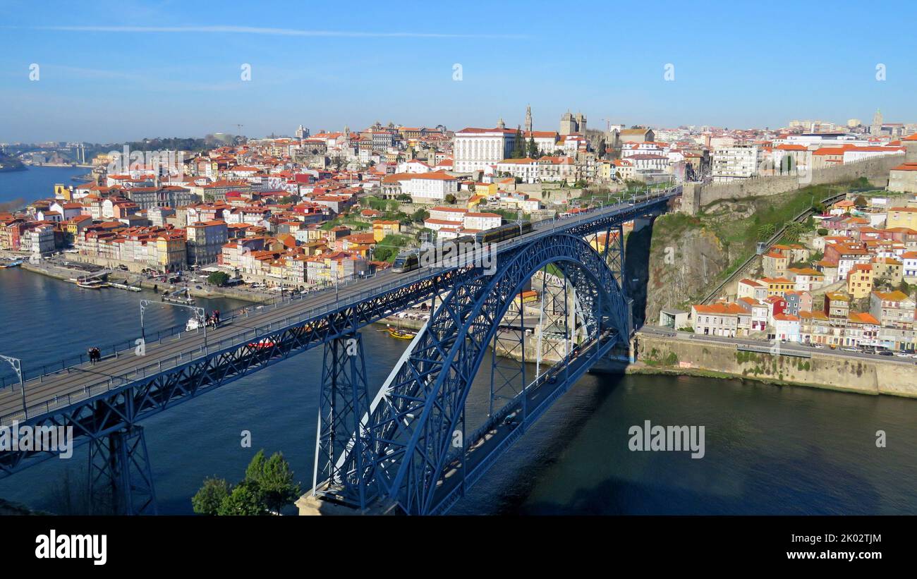 The aerial view of Dom Luis I Bridge and the colorful buildings of ...