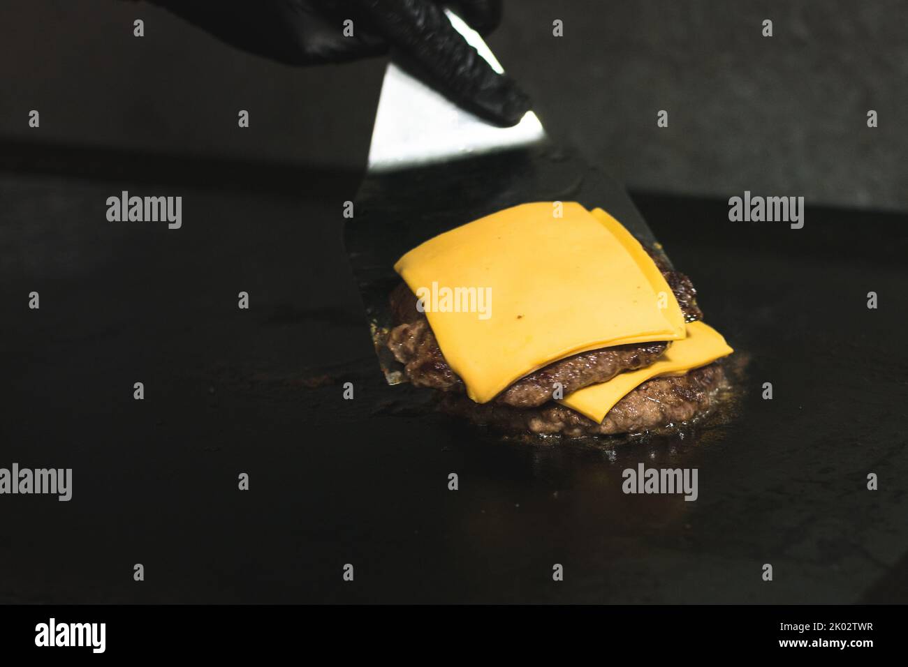 Burger making process hi-res stock photography and images - Alamy