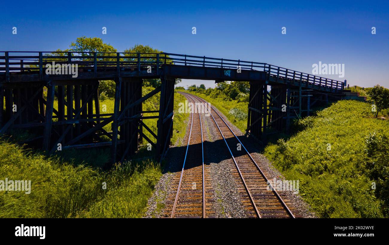 A rail bridge overpass over the train railway Stock Photo - Alamy