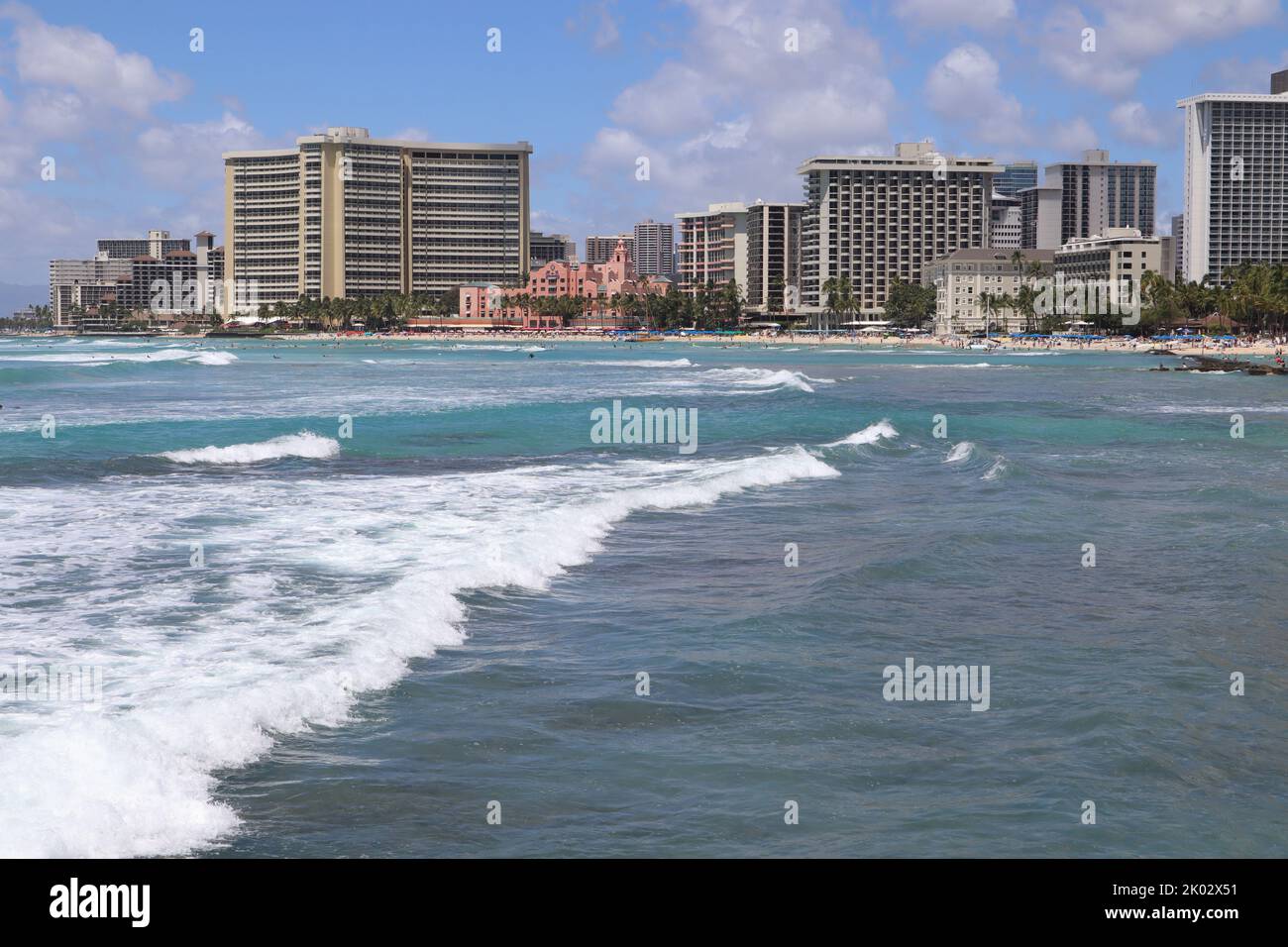 The Pacific Ocean waves rolling in to Waikiki Beach on the Hawaiian ...