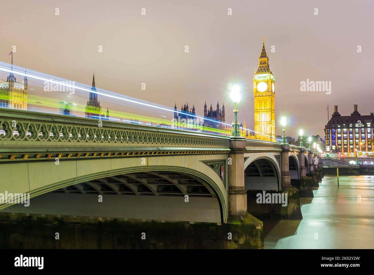 The Westminster Bridge and Big Ben in the evening with street lights on ...