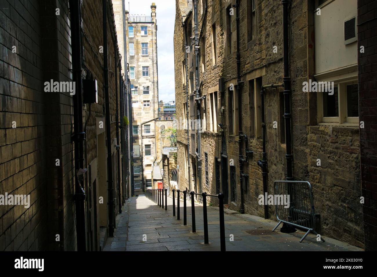 A narrow alley between old residential buildings Stock Photo - Alamy