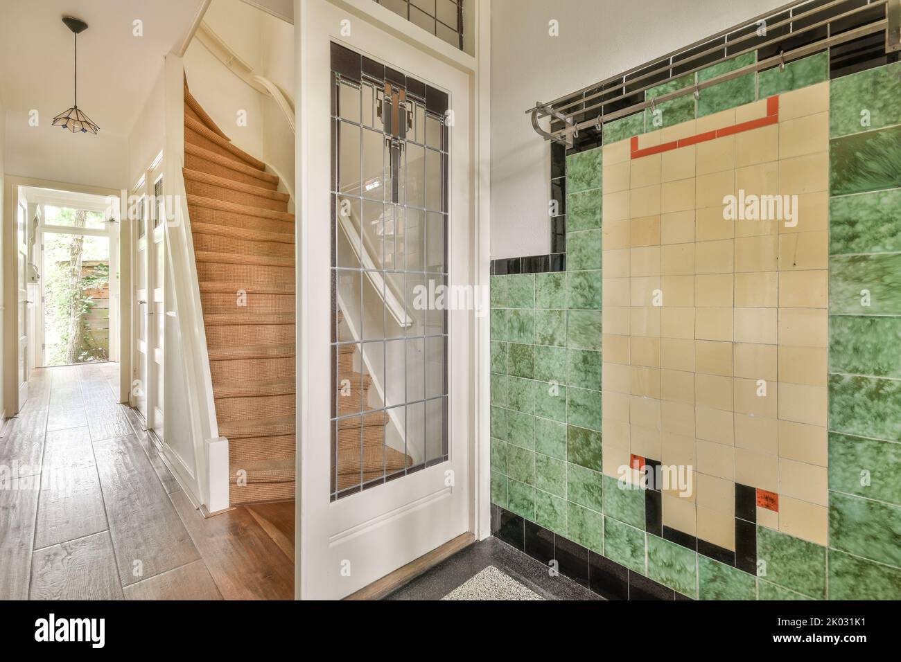 Light hallway with entrance door in two level apartment with minimalist ...