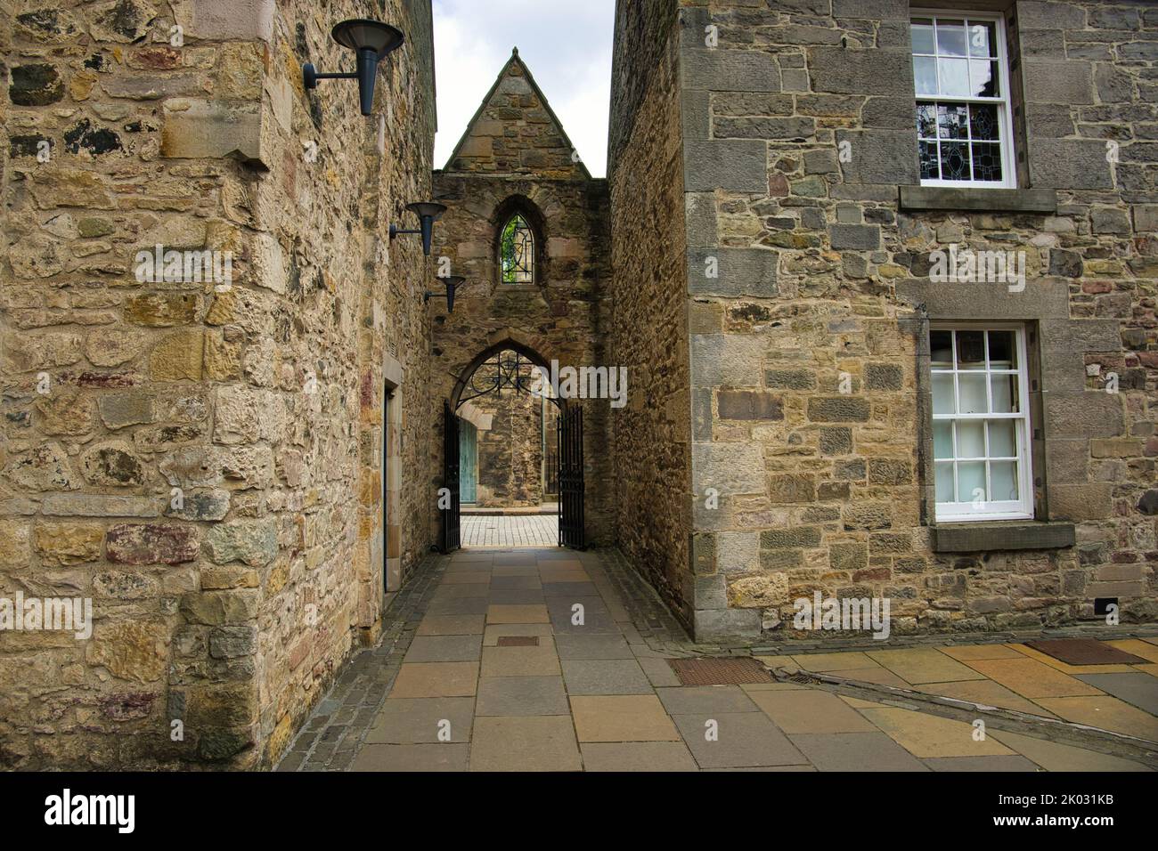 The exterior design details of an ancient fortress with white windows ...