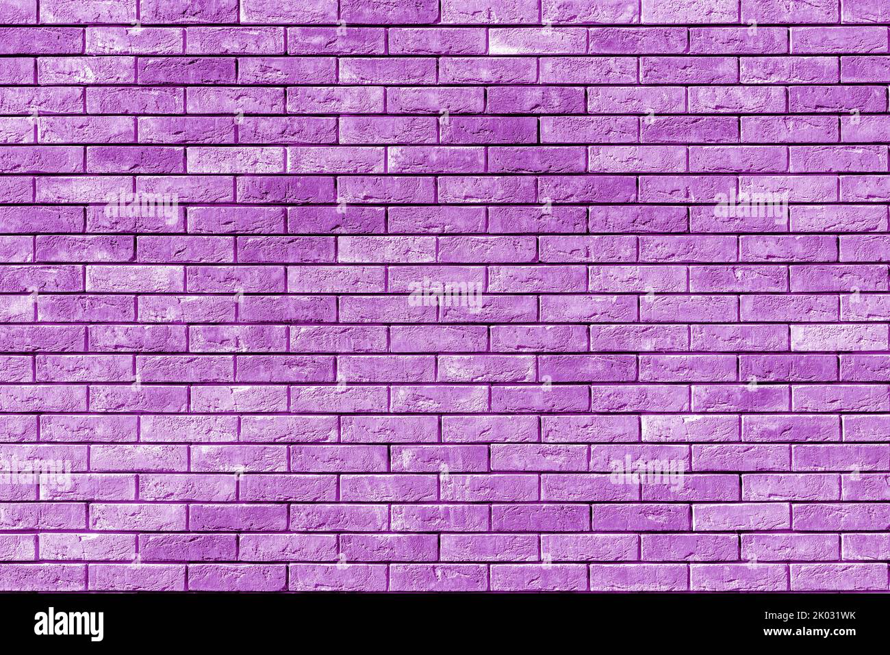 A Violet brick wall of a building Stock Photo - Alamy