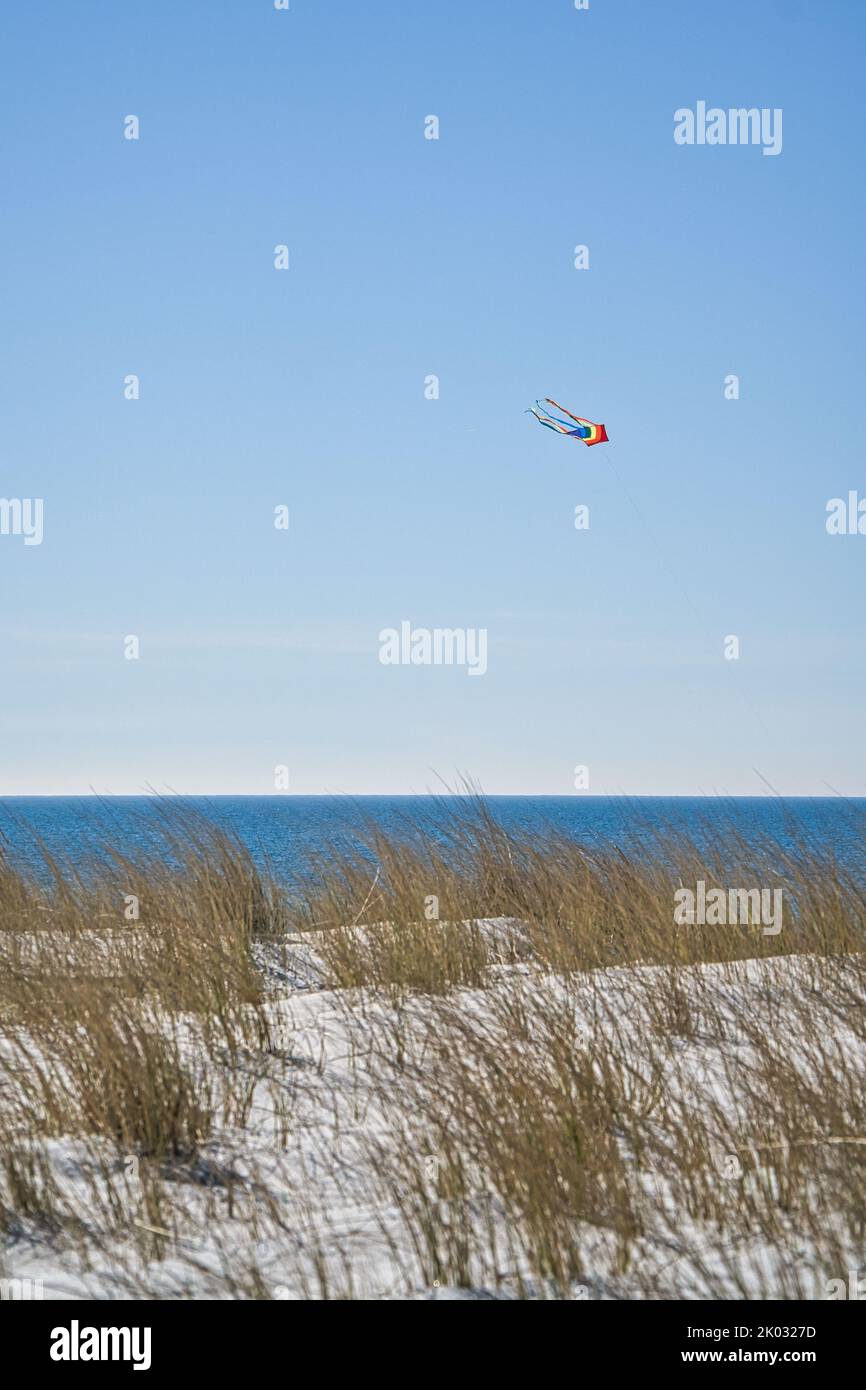 A beautiful view of a kite in a clear sky over the sandy beach Stock ...