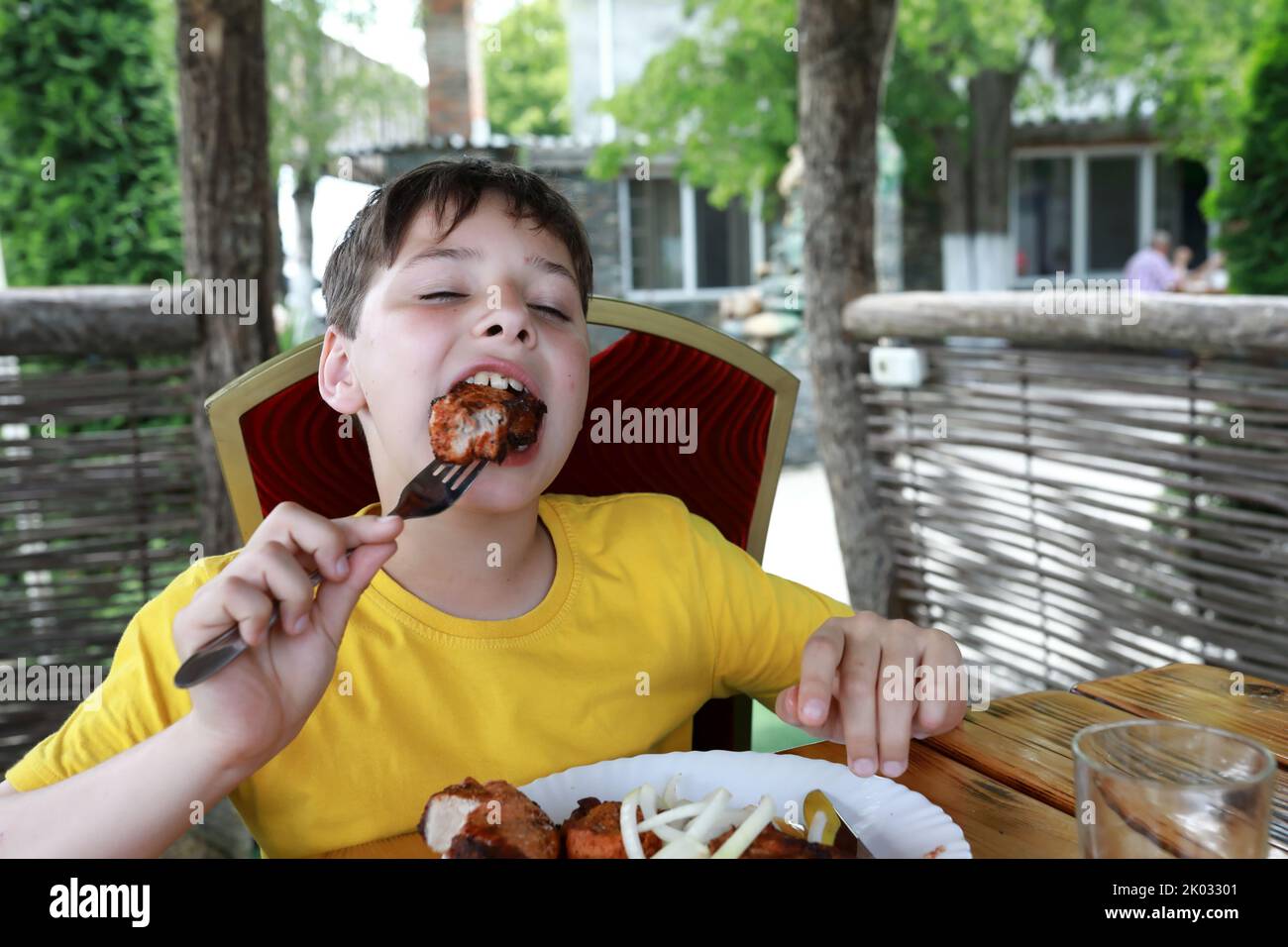 Child eating pork meat hi-res stock photography and images - Alamy