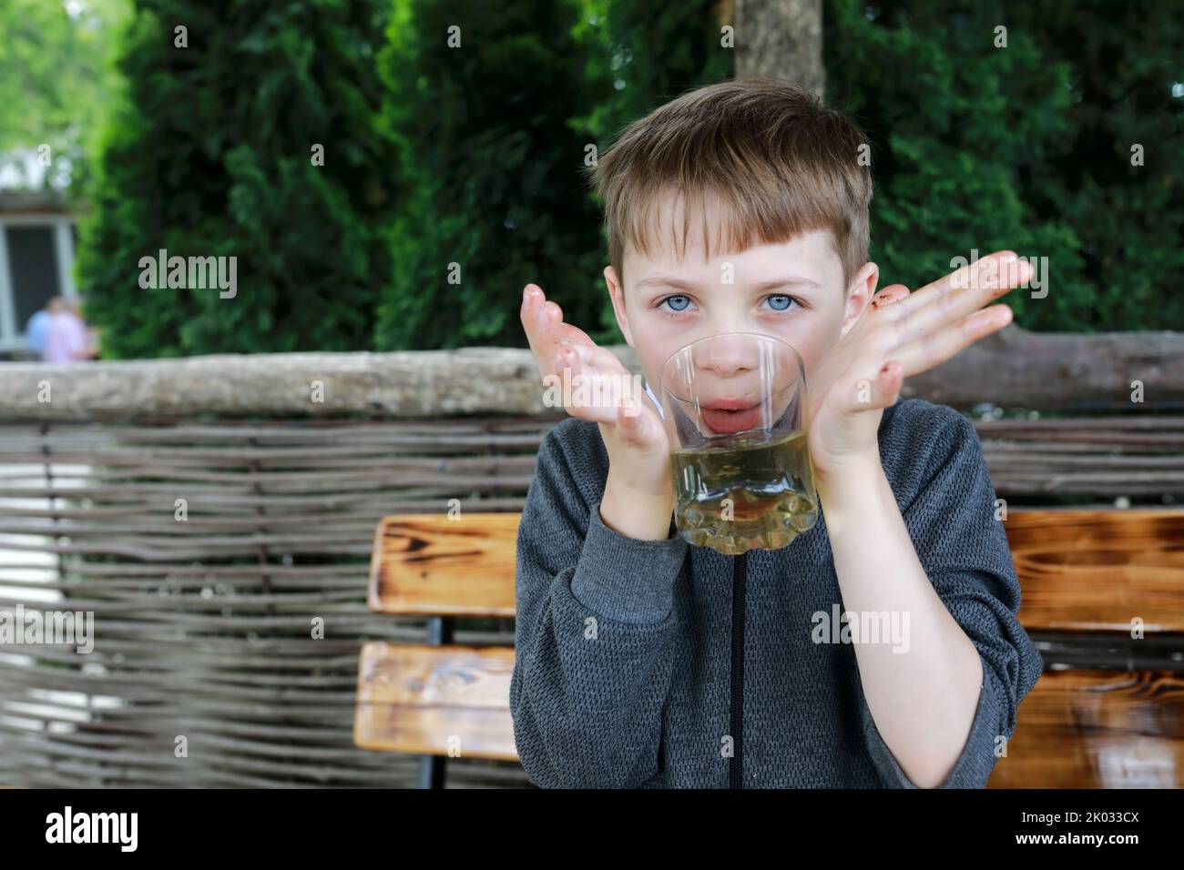 Child drinking juice terrace hi-res stock photography and images - Alamy