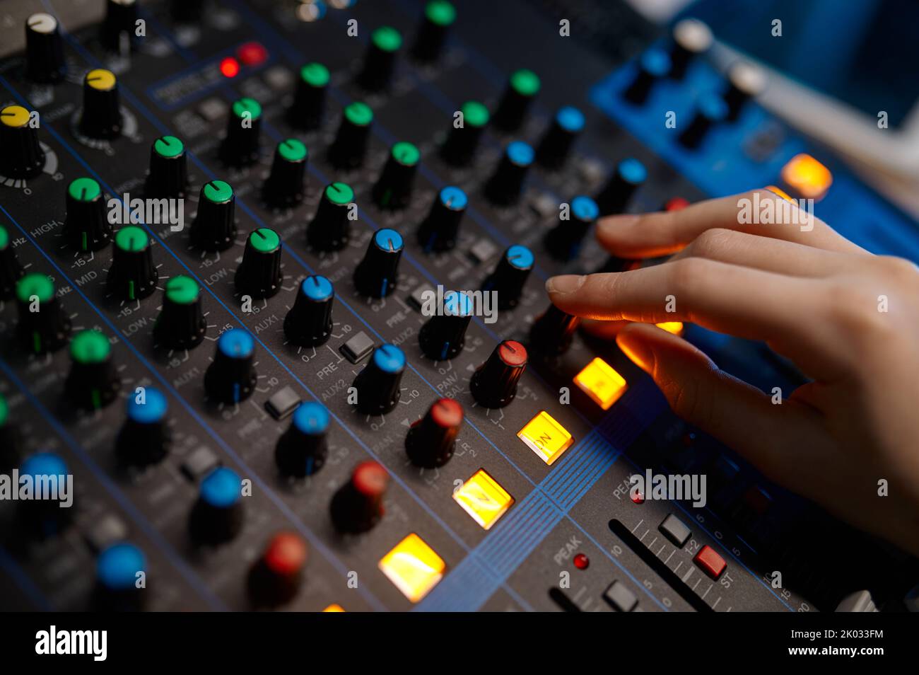 Closeup audio engineer hand on sound mixer control panel Stock Photo ...