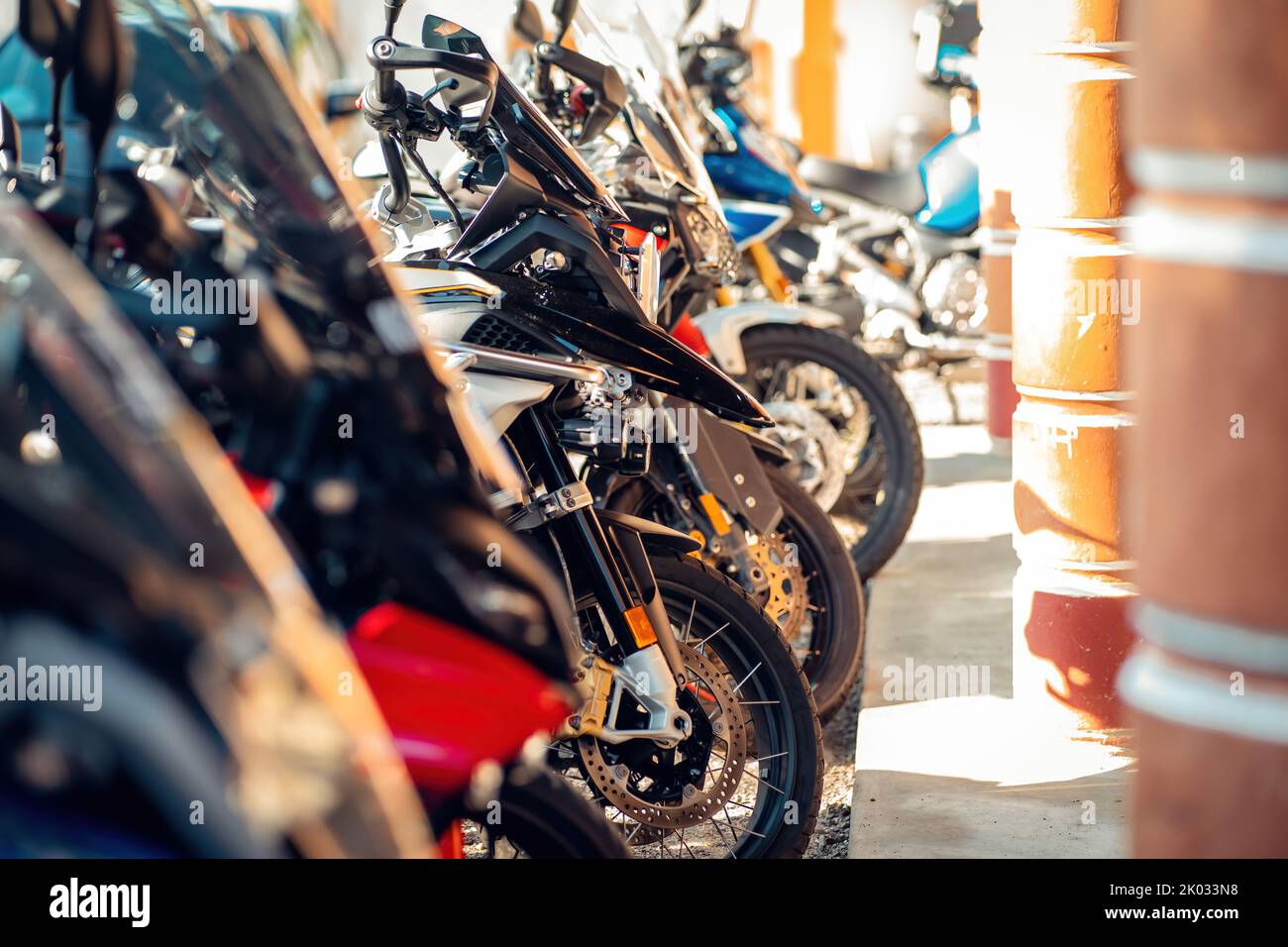 Motorcycles group parking on city street during adventure journey ...