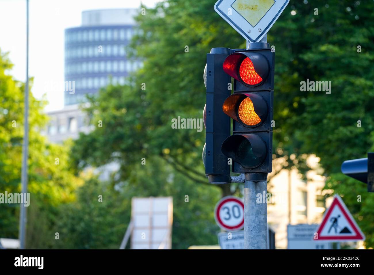 A closeup shot of a traffic light with red color on and a blur ...