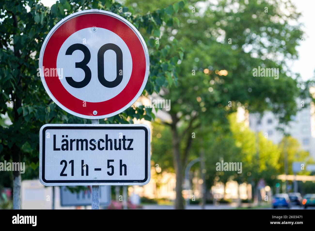 A closeup shot of a red circular traffic sign of 30km shield with a ...
