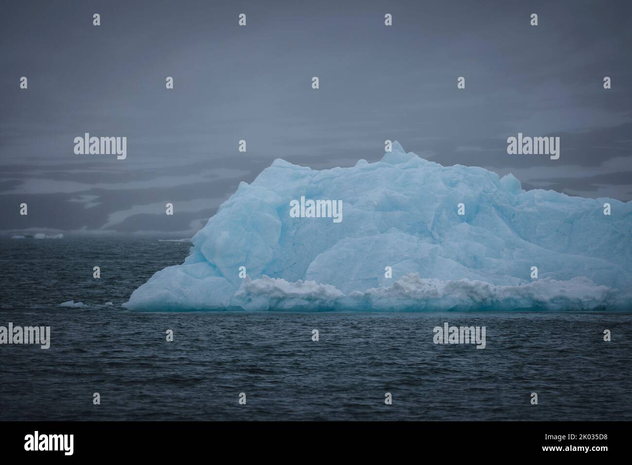 An iceberg drifts off the coast near spitsbergen hi-res stock ...