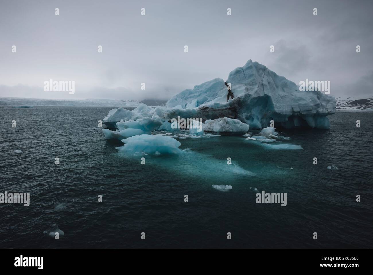 An iceberg drifts off the coast near spitsbergen hi-res stock ...