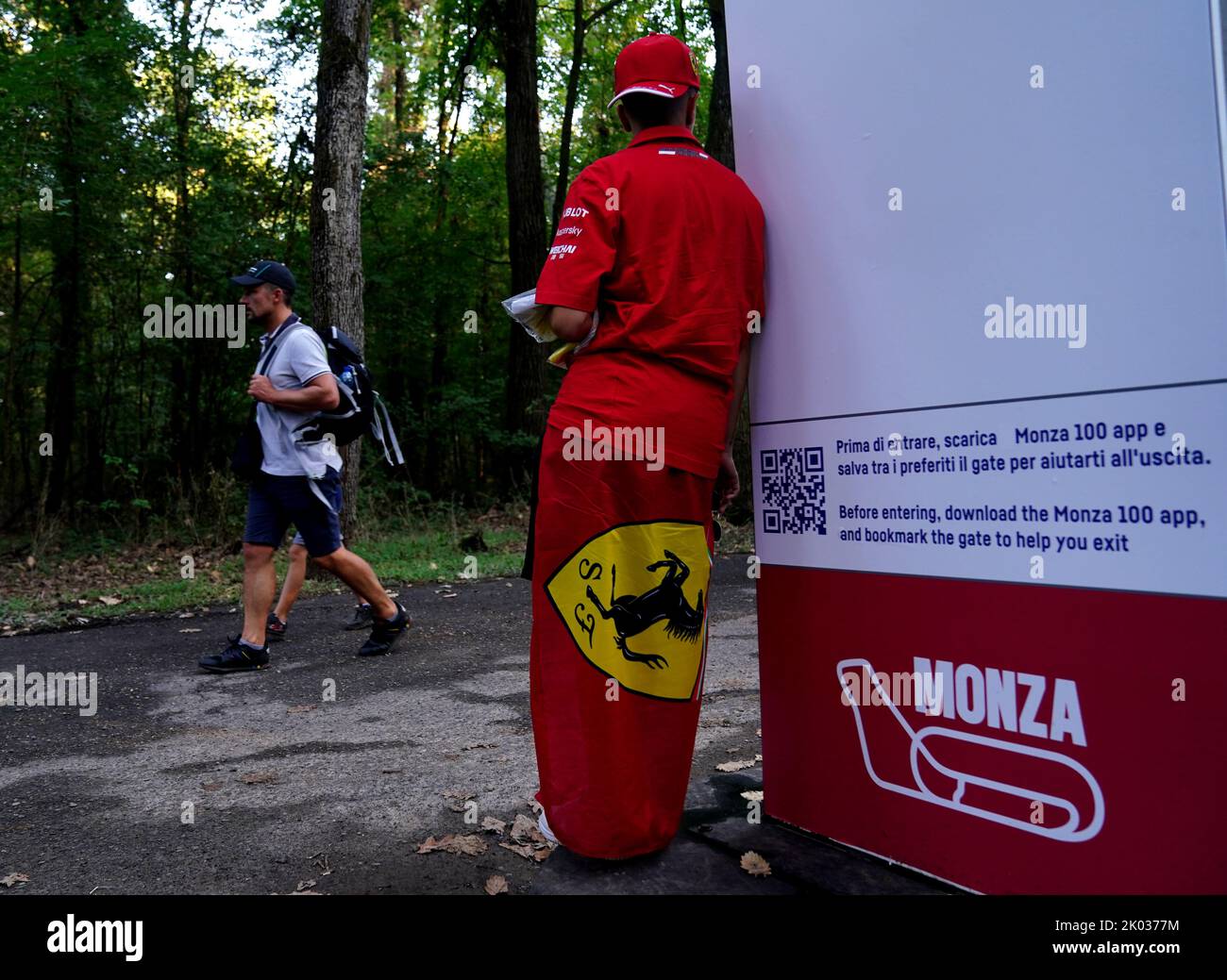 A race goer wearing a Ferrari flag at the Italian Grand Prix, Monza ...