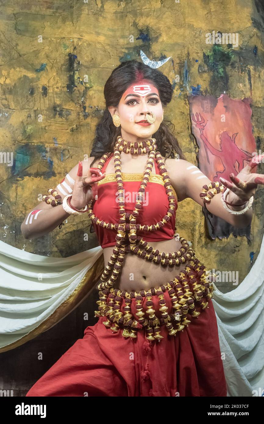 Concept Agomoni shoot with black haired Indian brunette woman face with ...