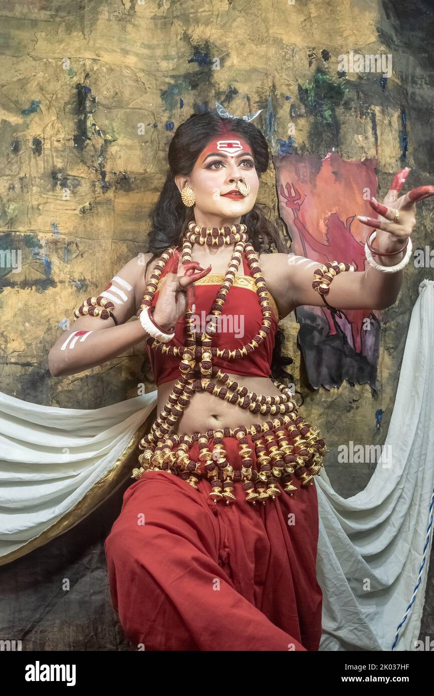 Concept Agomoni shoot with black haired Indian brunette woman face with ...