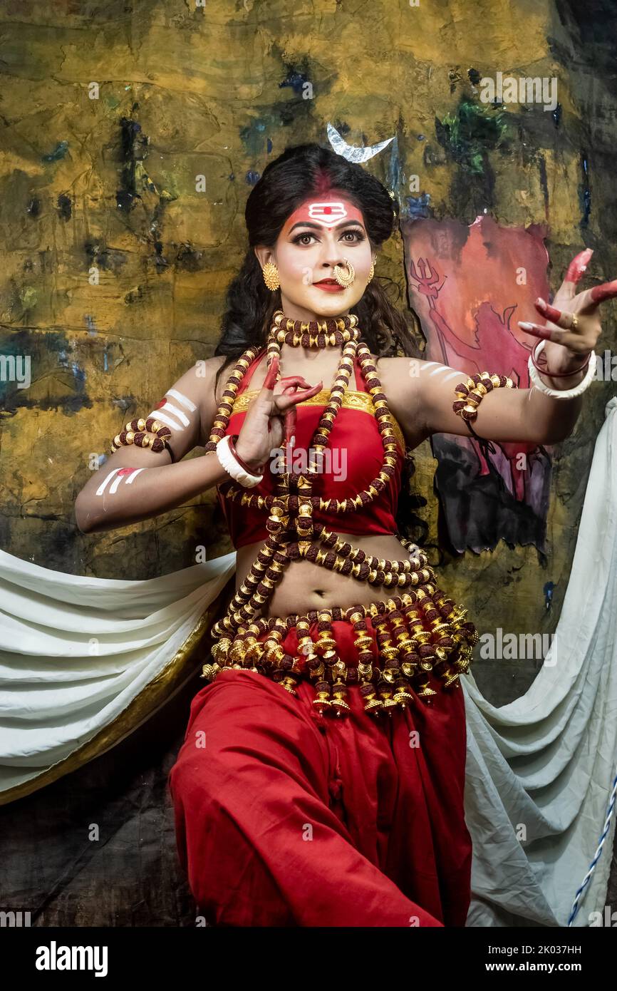 Concept Agomoni shoot with black haired Indian brunette woman face with ...