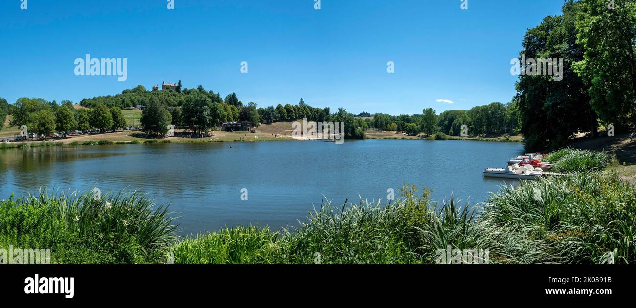 The castle of Montfort overlooking the lake of Vernet la Varenne. Puy ...
