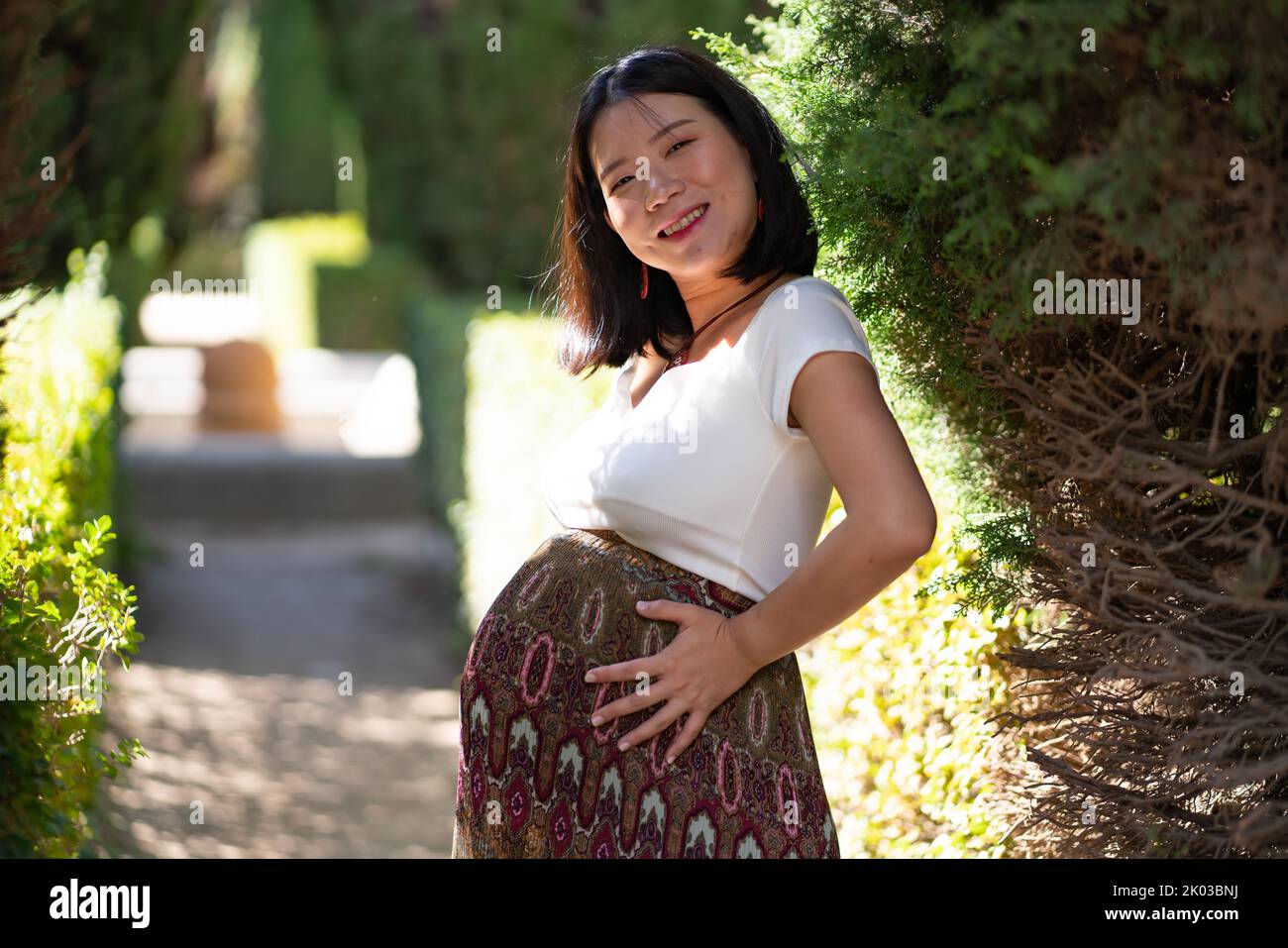 young happy and beautiful Asian Chinese woman posing outdoors happy and ...