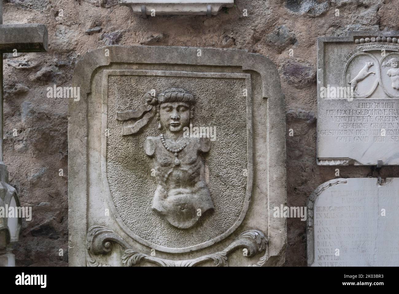 Historical tomb slab on the exterior façade of the parish church of St ...