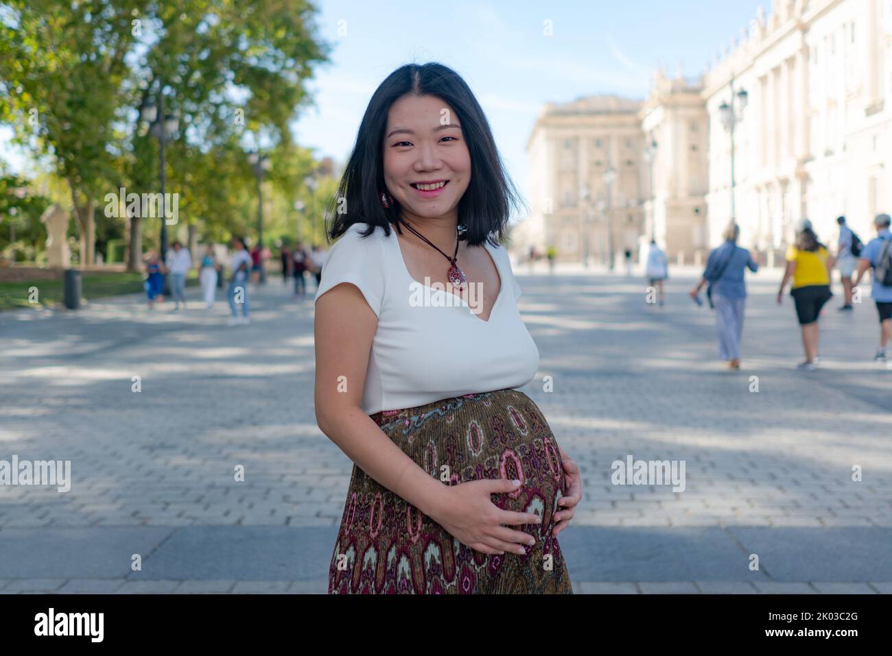 young happy and beautiful Asian Chinese woman posing outdoors happy and ...