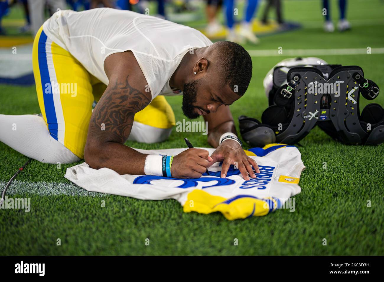 Los Angeles Rams safety Terrell Burgess (26) signs his Jersey to ...