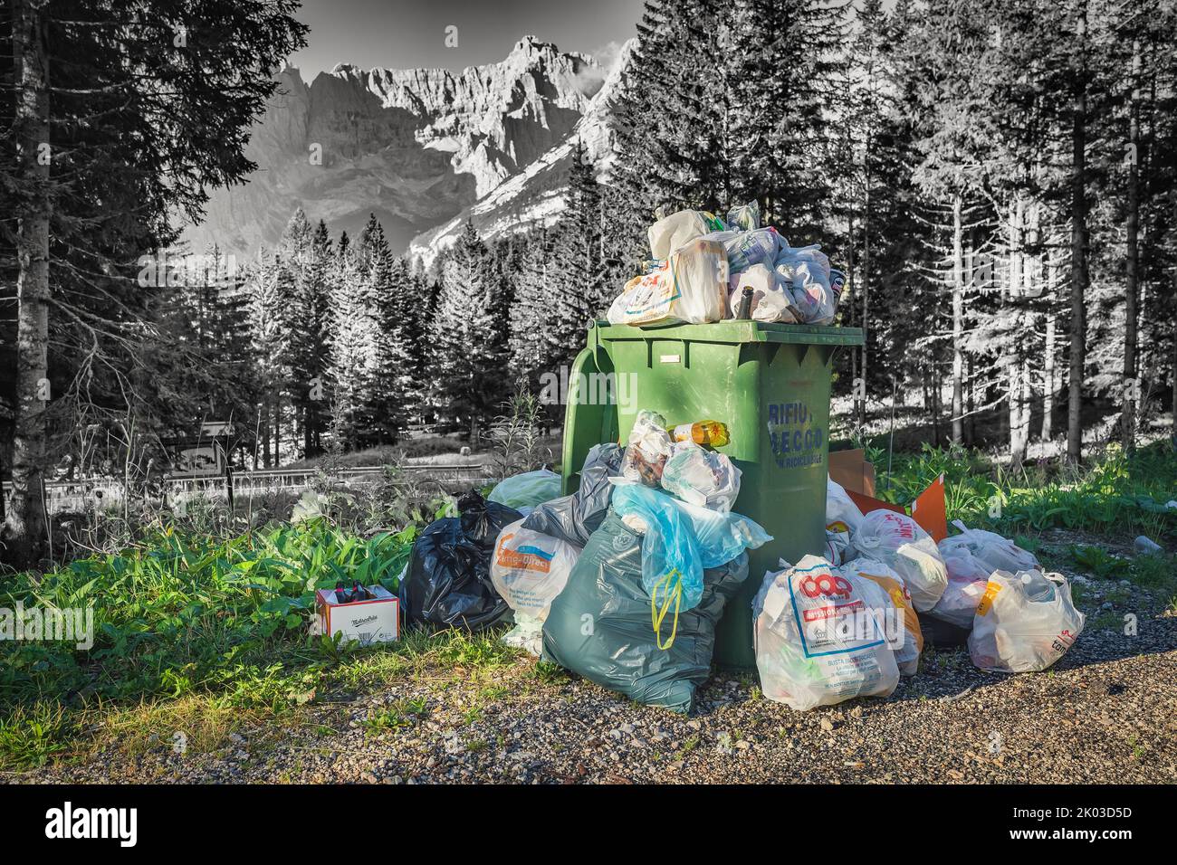 garbage abandoned along a mountain road in the Dolomites, mass tourism ...