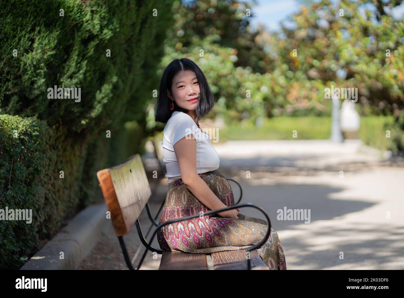 young happy and beautiful Asian Japanese woman pregnant showing her ...