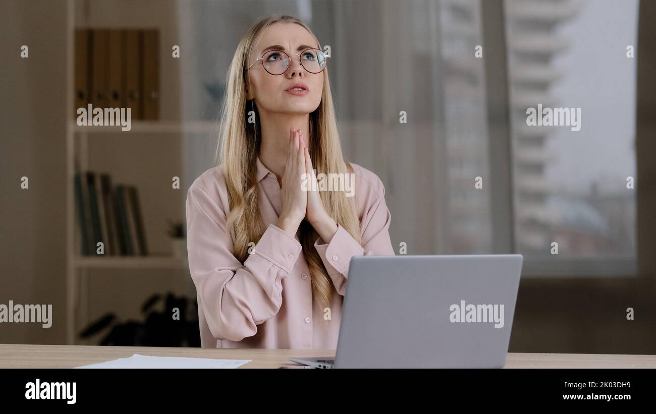 Praying Caucasian millennial student girl worker user gamer business ...