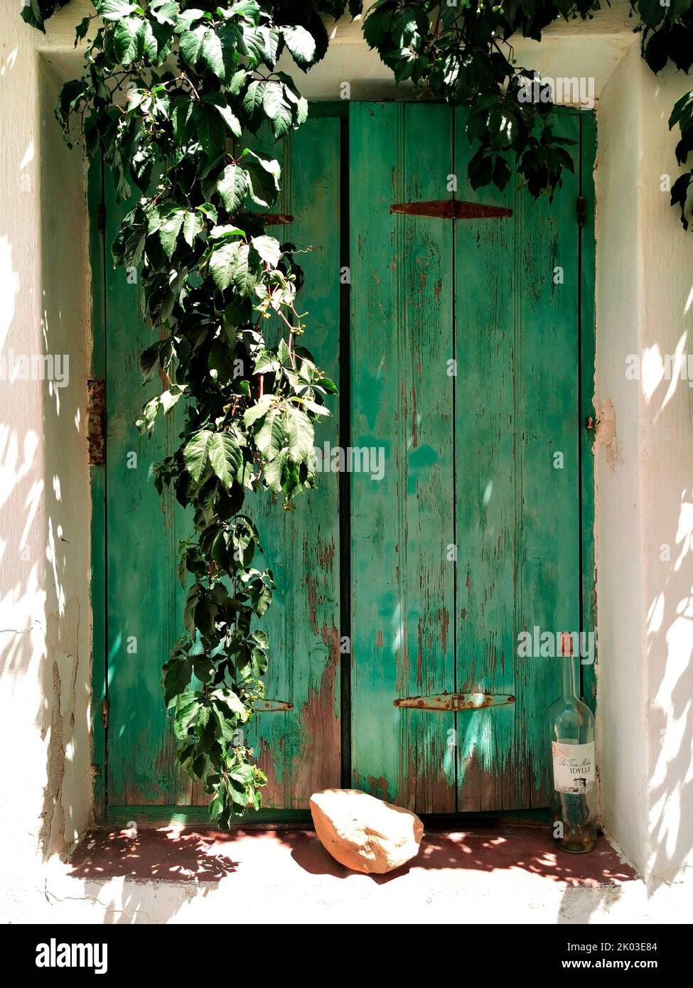Old wooden window covering on a house facade on the Greek island of ...