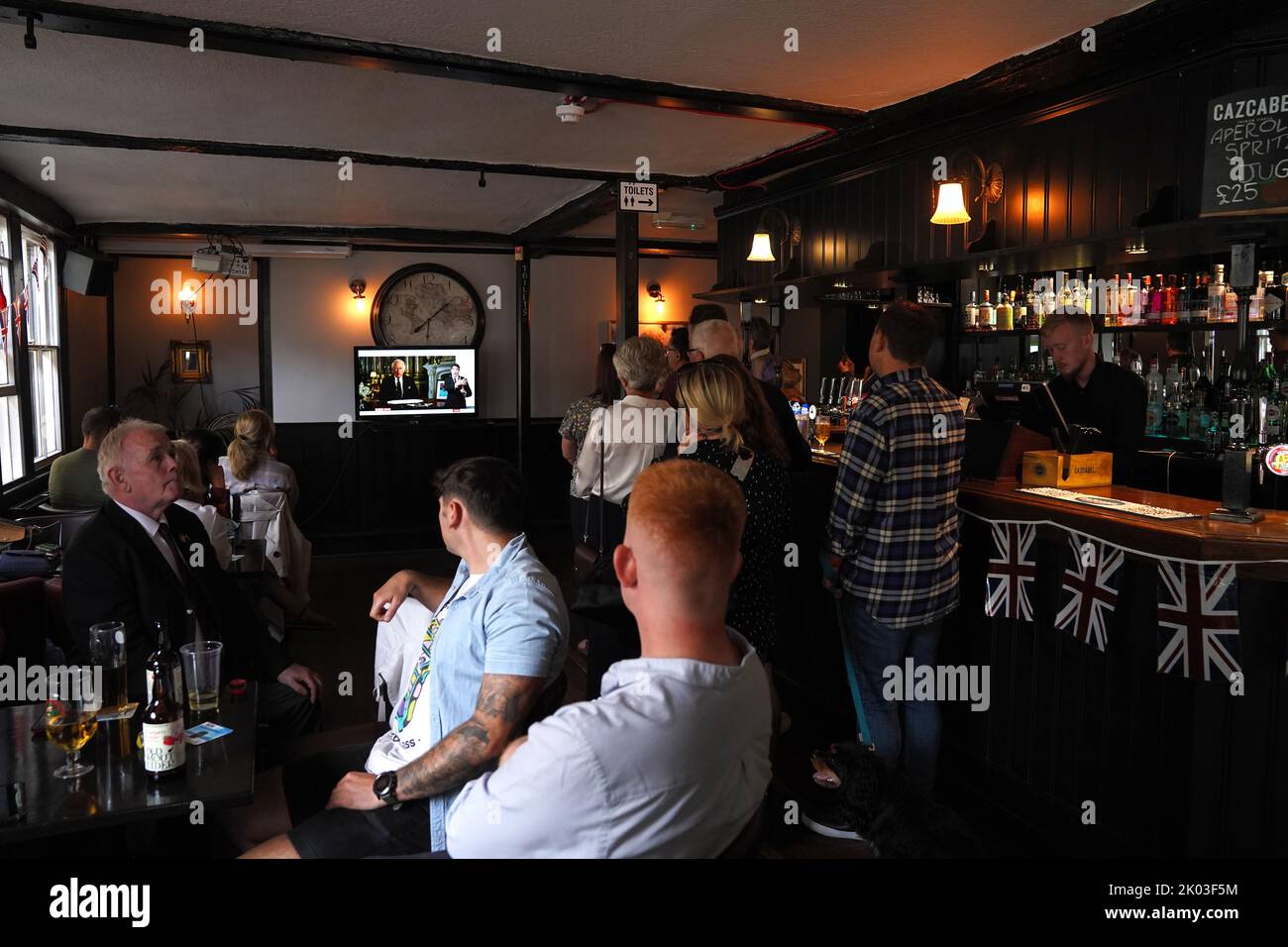 Members of the public in The Prince Harry Pub, Windsor, watching a ...