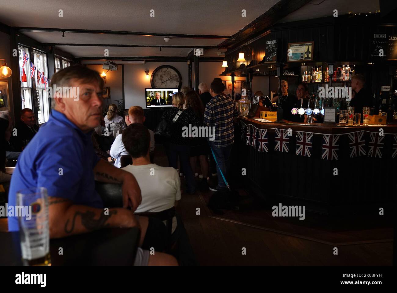 Members of the public in The Prince Harry Pub, Windsor, watching a ...