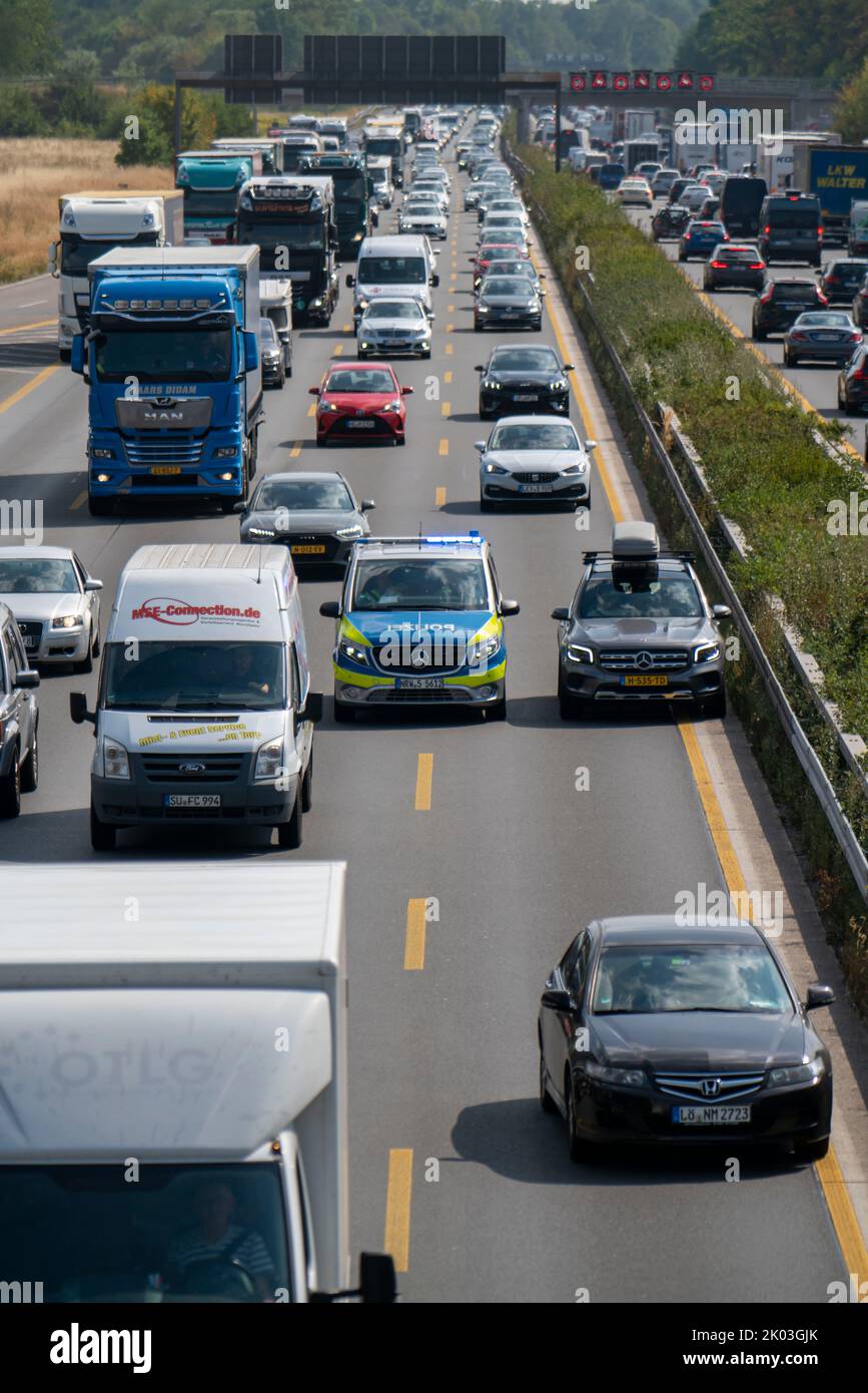 Police patrol car works its way through a traffic jam on the A3 ...