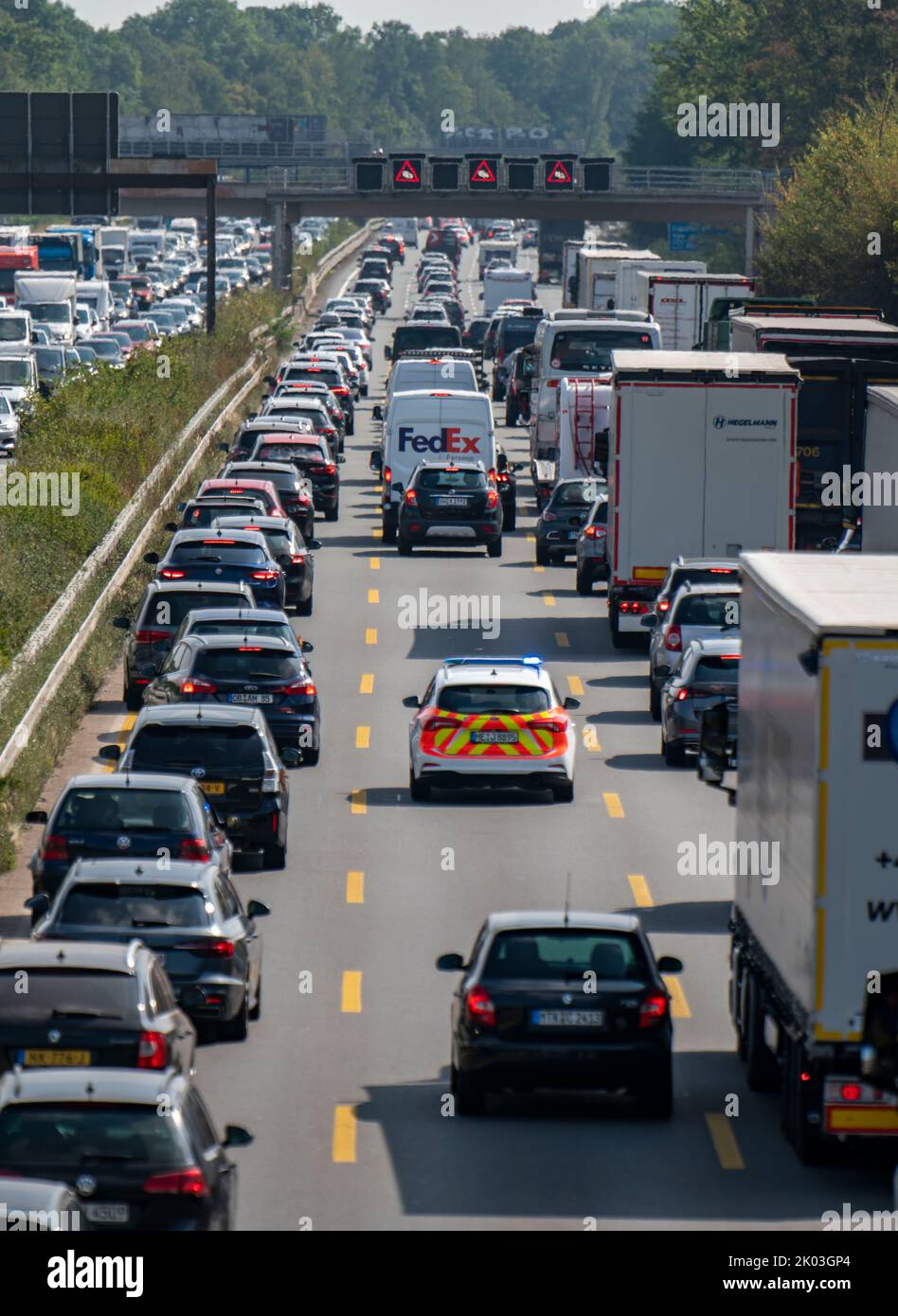 Emergency ambulance works its way through a traffic jam on the A3 ...