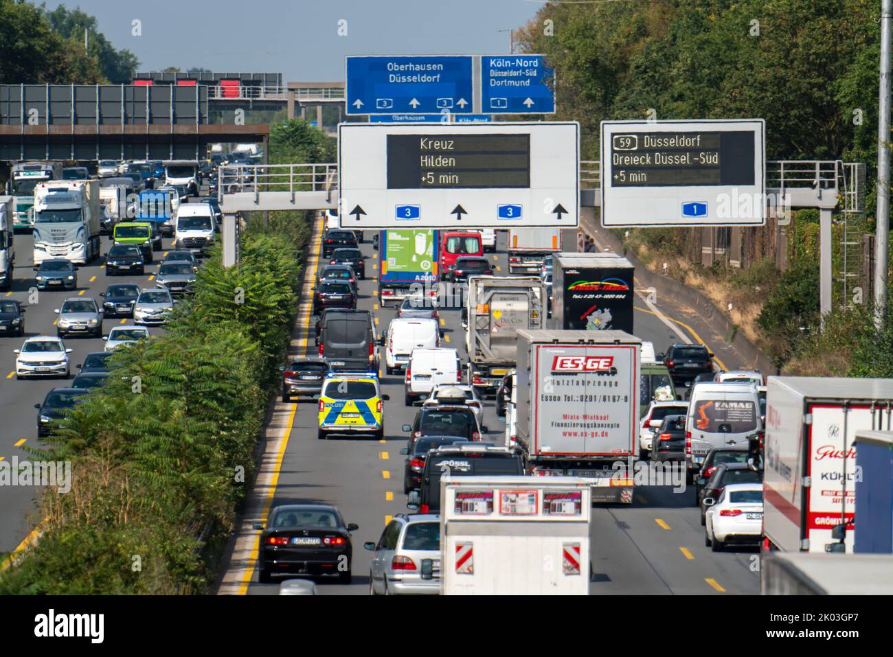 Police patrol car works its way through a traffic jam on the A3 ...
