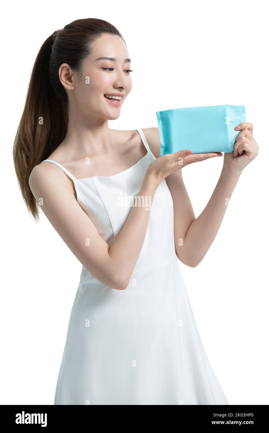 Beautiful young Chinese woman showing wet wipe Stock Photo - Alamy