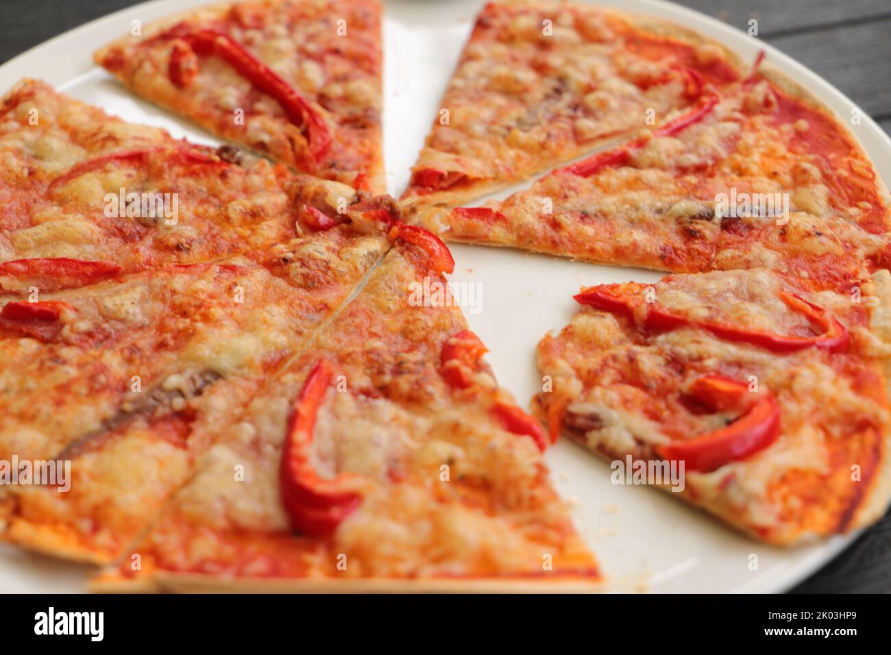 Pizza with peppers, anchovies and cheese Stock Photo - Alamy