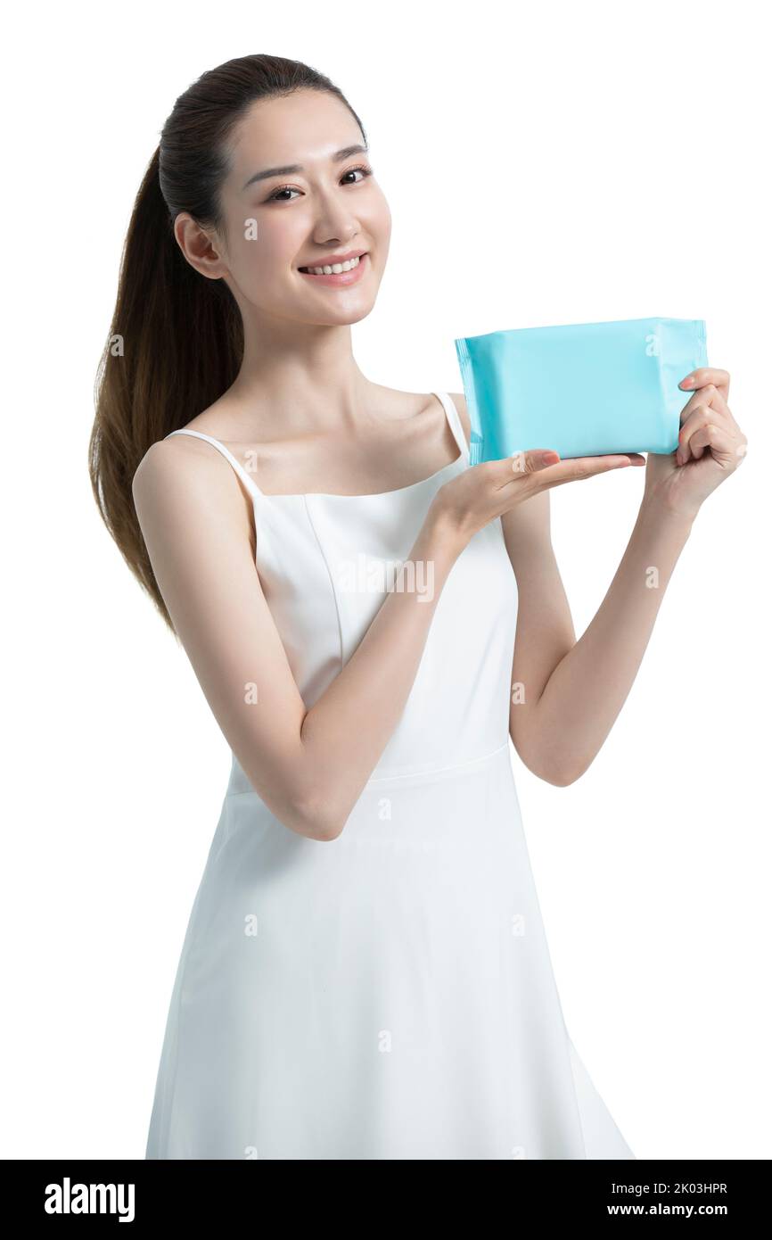 Beautiful young Chinese woman showing wet wipe Stock Photo - Alamy