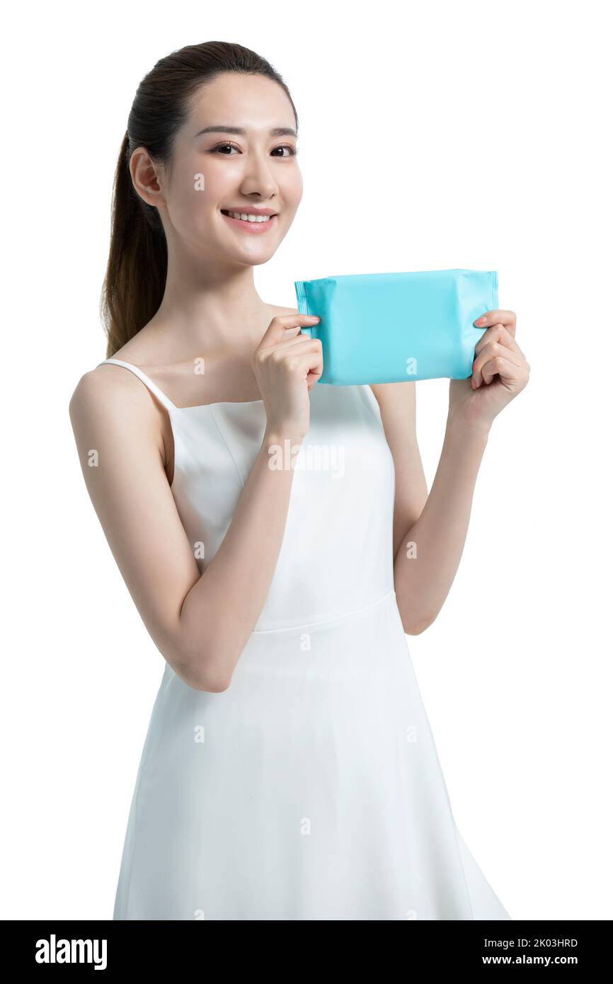 Beautiful young Chinese woman showing wet wipe Stock Photo - Alamy
