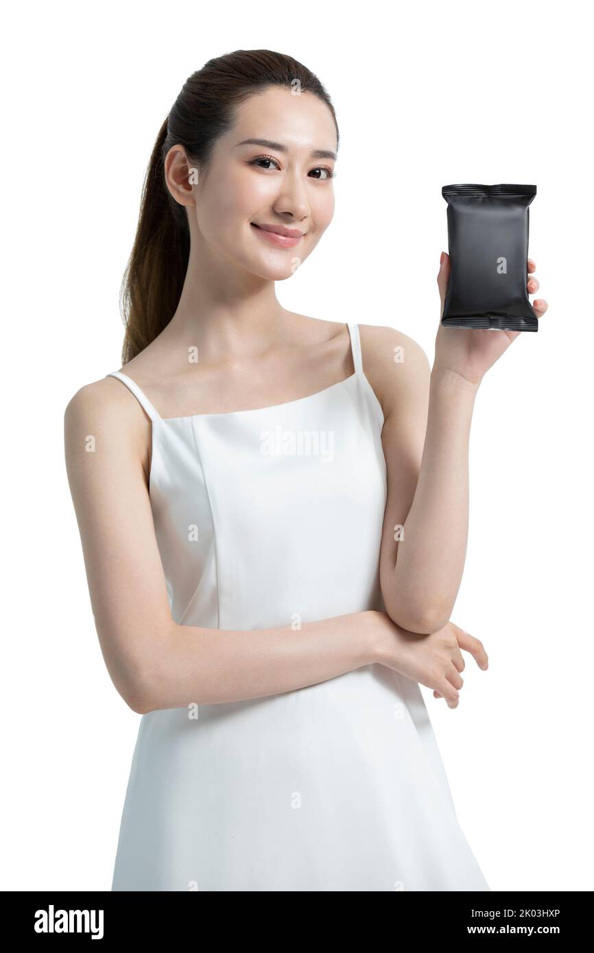 Beautiful young Chinese woman showing wet wipe Stock Photo - Alamy