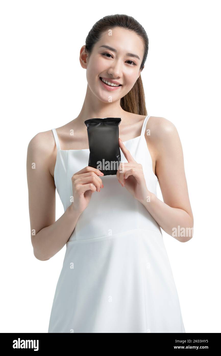 Beautiful young Chinese woman showing wet wipe Stock Photo - Alamy
