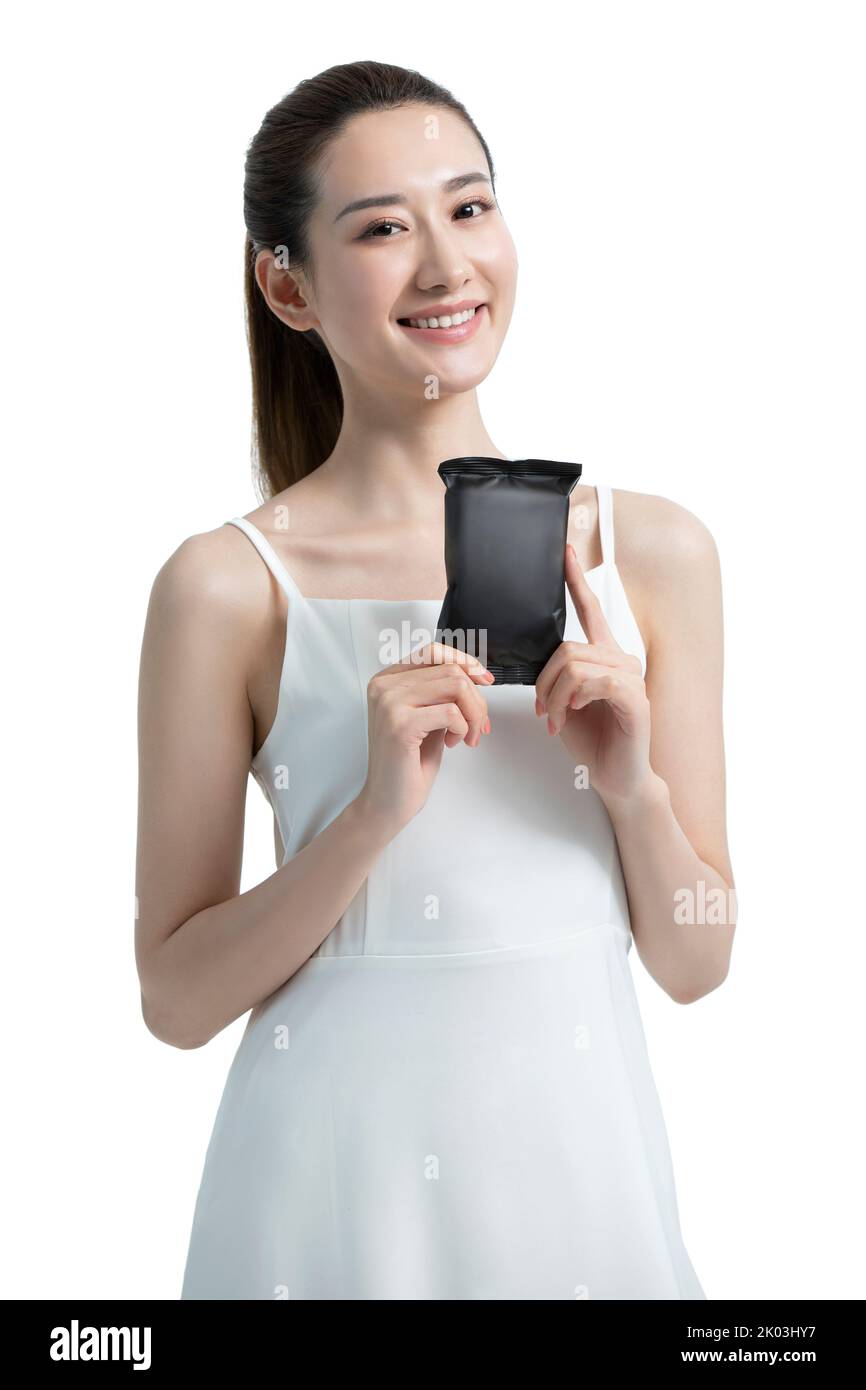 Beautiful young Chinese woman showing wet wipe Stock Photo - Alamy