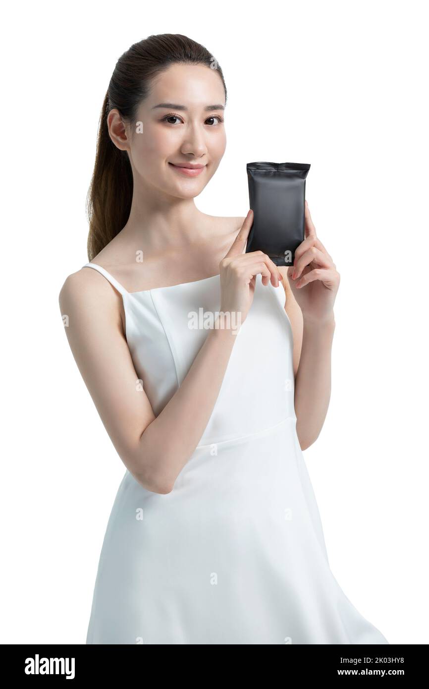 Beautiful young Chinese woman showing wet wipe Stock Photo - Alamy