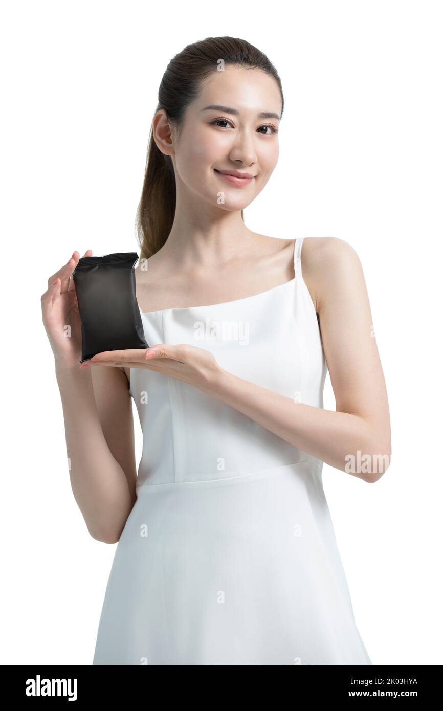Beautiful young Chinese woman showing wet wipe Stock Photo - Alamy